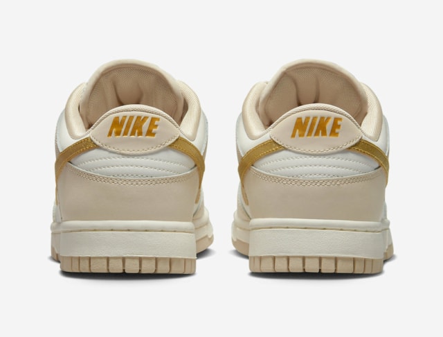 Nike Adds Gold Swoosh Logos to the Dunk Low · JustFreshKicks